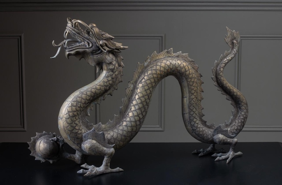 A Large Brass Dragon Chasing The Flaming Pearl Of Knowledge | Vinterior